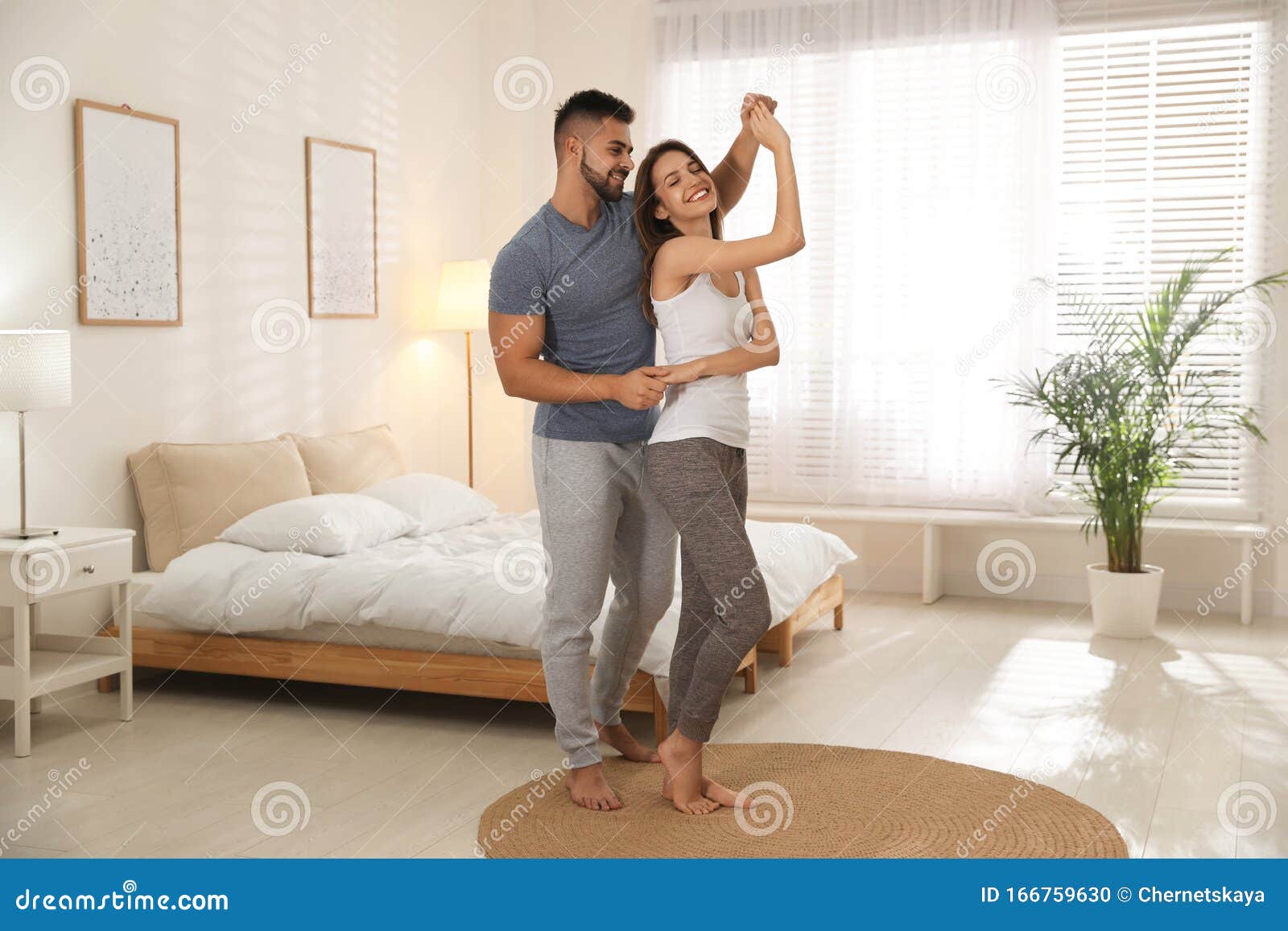 Lovely Young Couple Dancing in Bedroom Stock Photo - Image of love ...