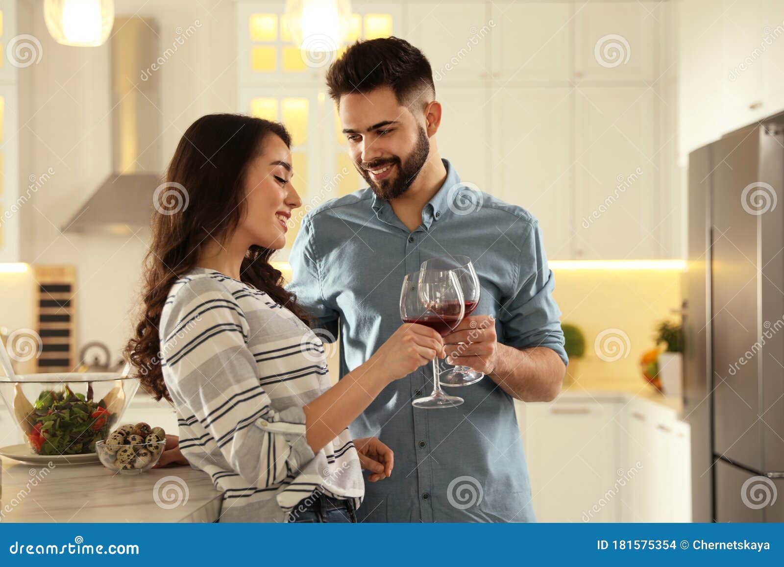Lovely Couple Drinking Wine while Cooking Together at Kitchen Stock ...