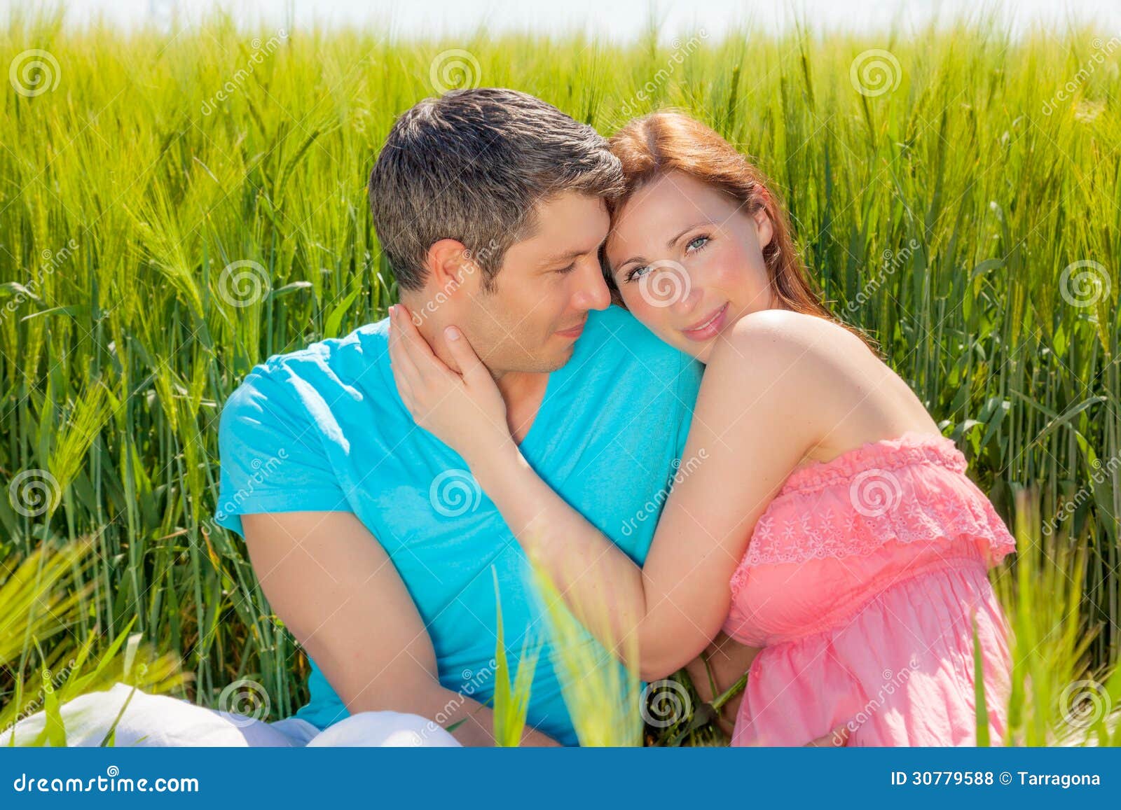 Lovers in green stock photo. Image of embrace, casual - 30779588