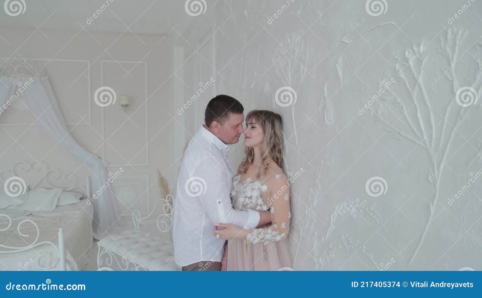 Lovers Hug Against the Wall in the Room. Stock Footage - Video of ...