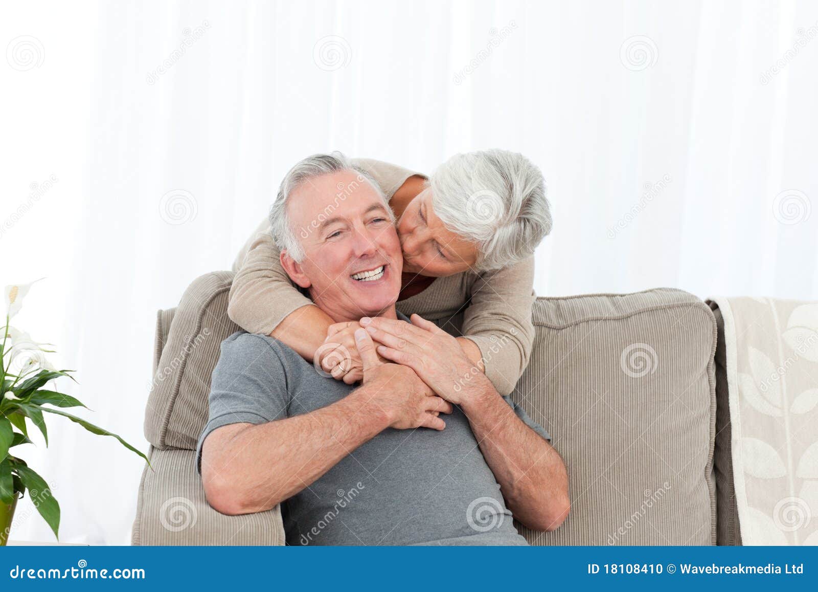 Lovers Hugging in the Couch Stock Photo - Image of maturity, care: 18108410