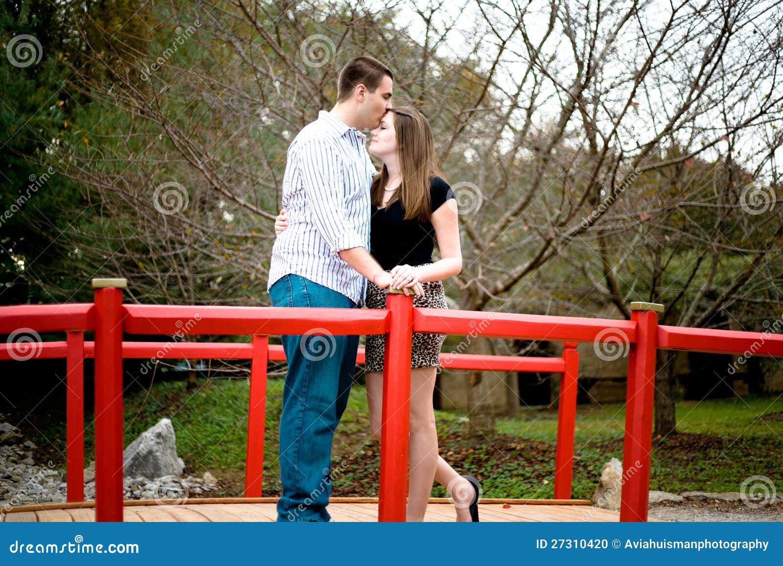 Lovers on a Red Bridge stock photo. Image of excitement - 27310420