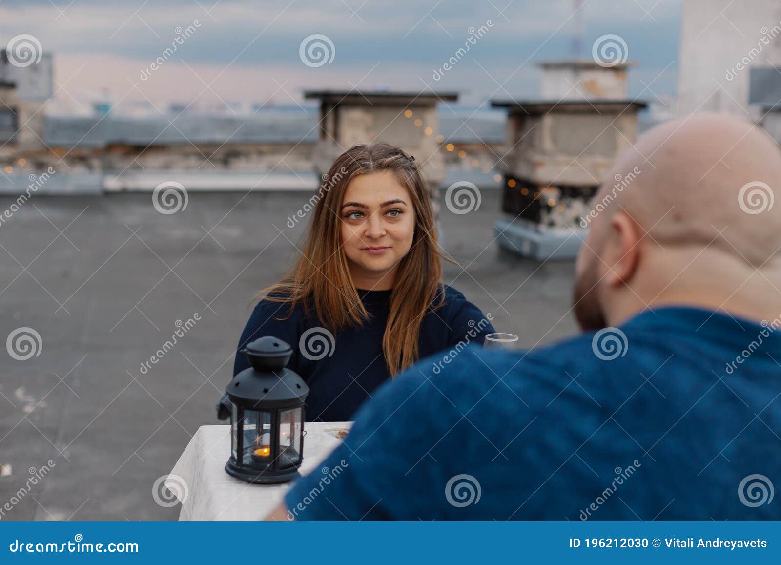 Lovers on the Roof Sit at a Table with Champagne. Stock Photo - Image ...
