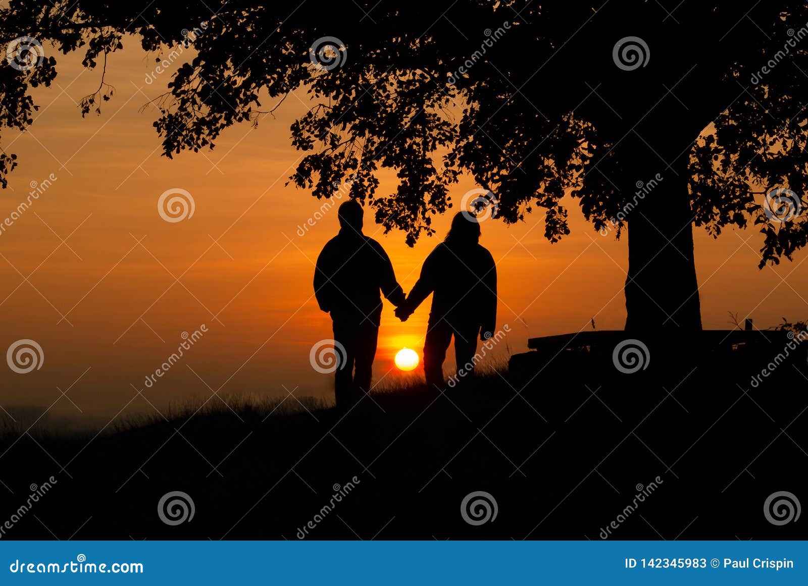 Lovers in the sunset stock image. Image of relationship - 142345983