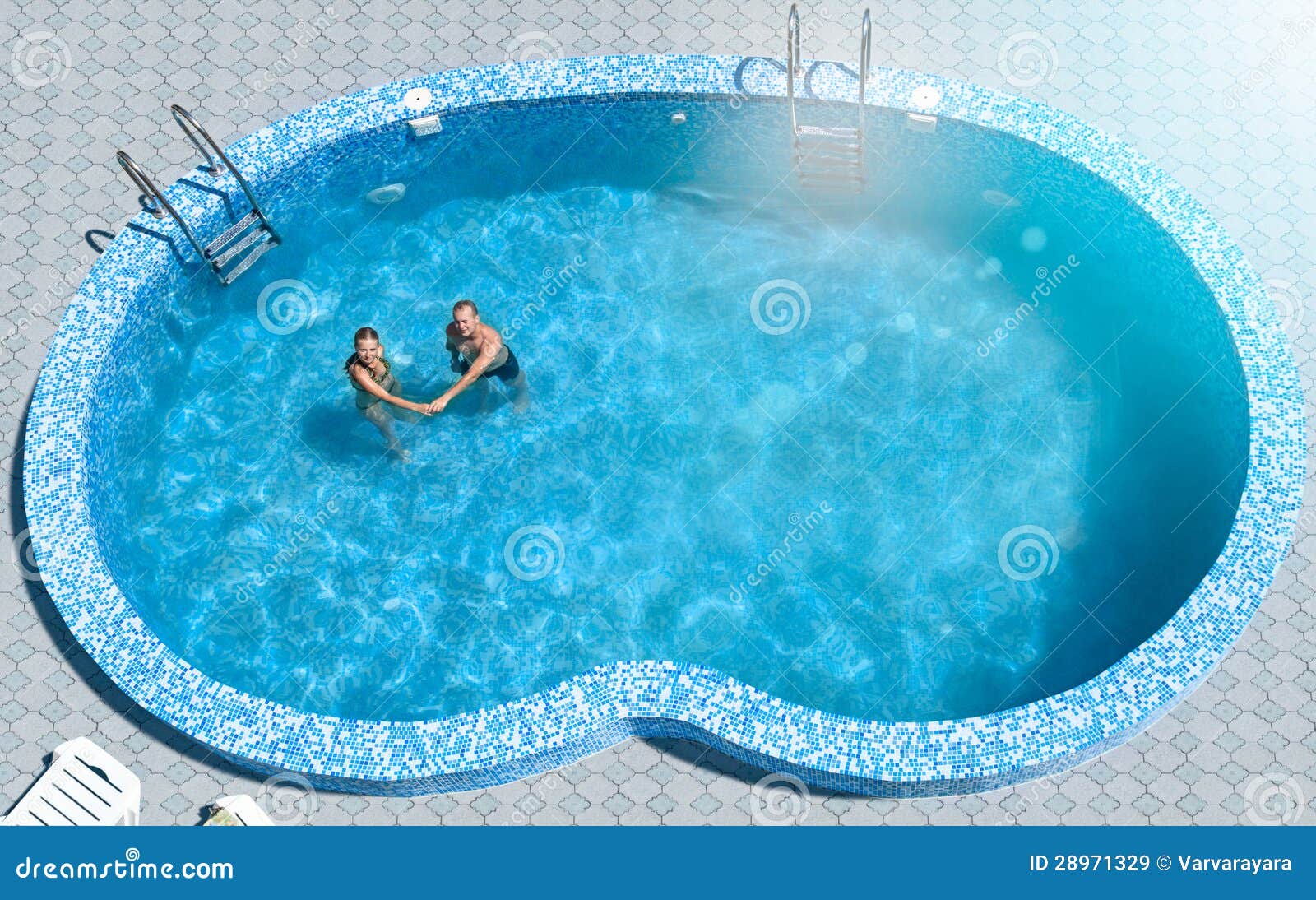 Lovers swim in the pool stock image. Image of sensuality - 28971329
