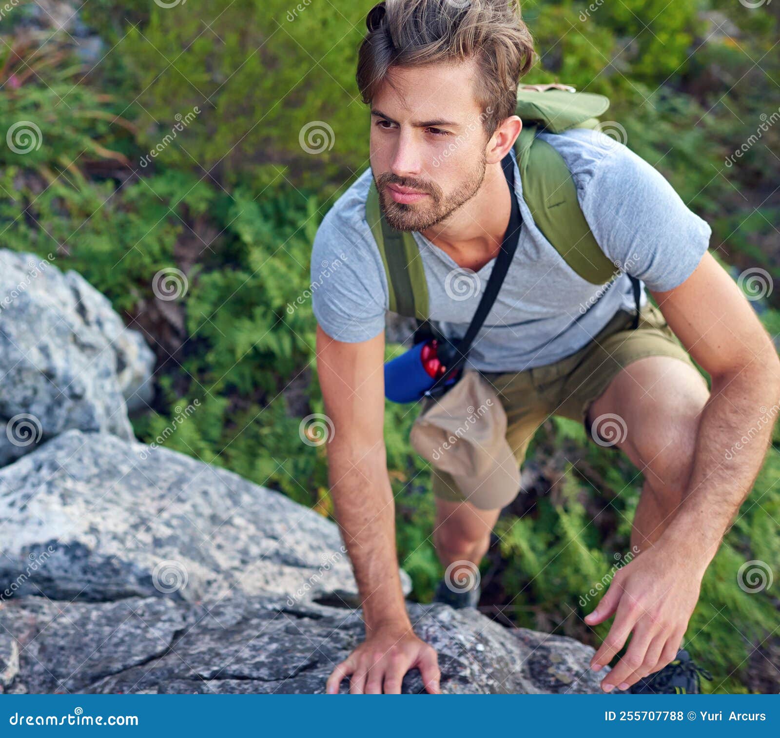 He Loves the Climb. a Handsome Young Man Scaling a Mountain. Stock ...