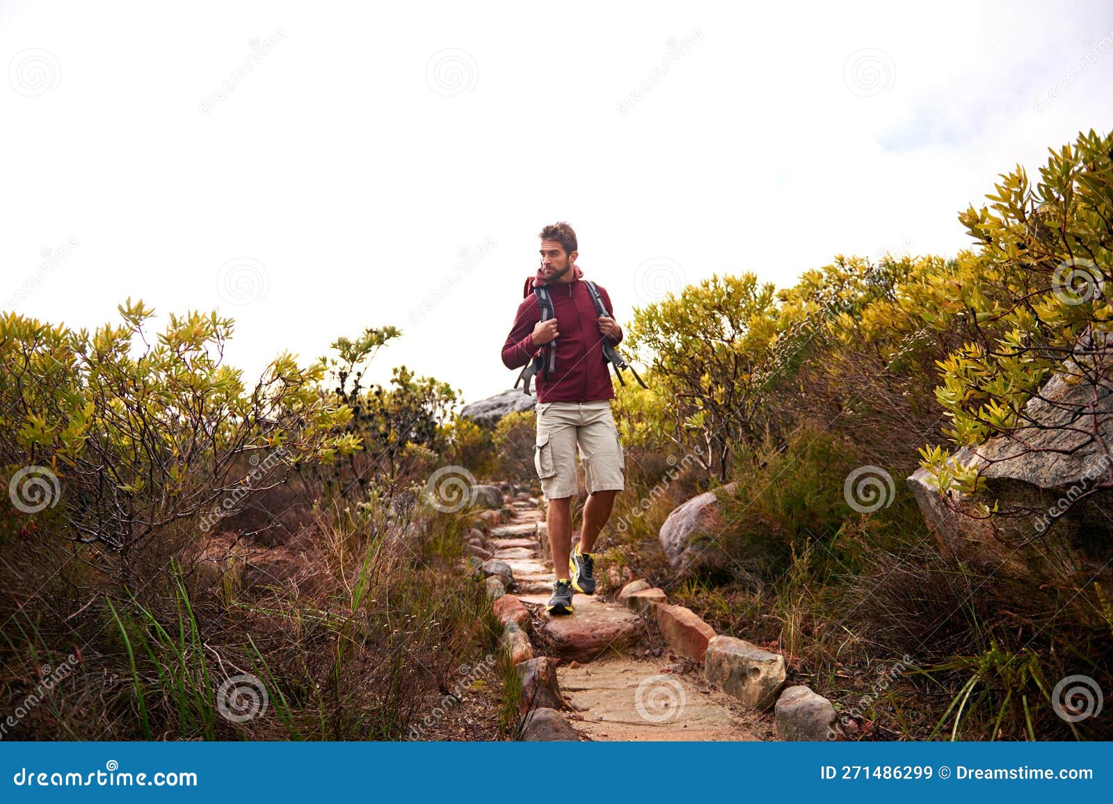 He Loves a Good Hike. a Young Man Enjoying a Hike through the Mountains ... He Loves a Good Hike. a Young Man Enjoying a Hike through the Mountains ...
