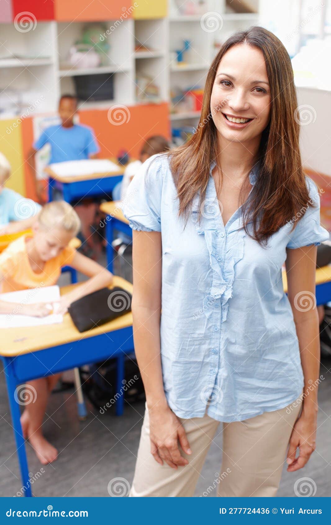 She Loves Teaching Portrait Of A Pretty Young Teacher Standing With