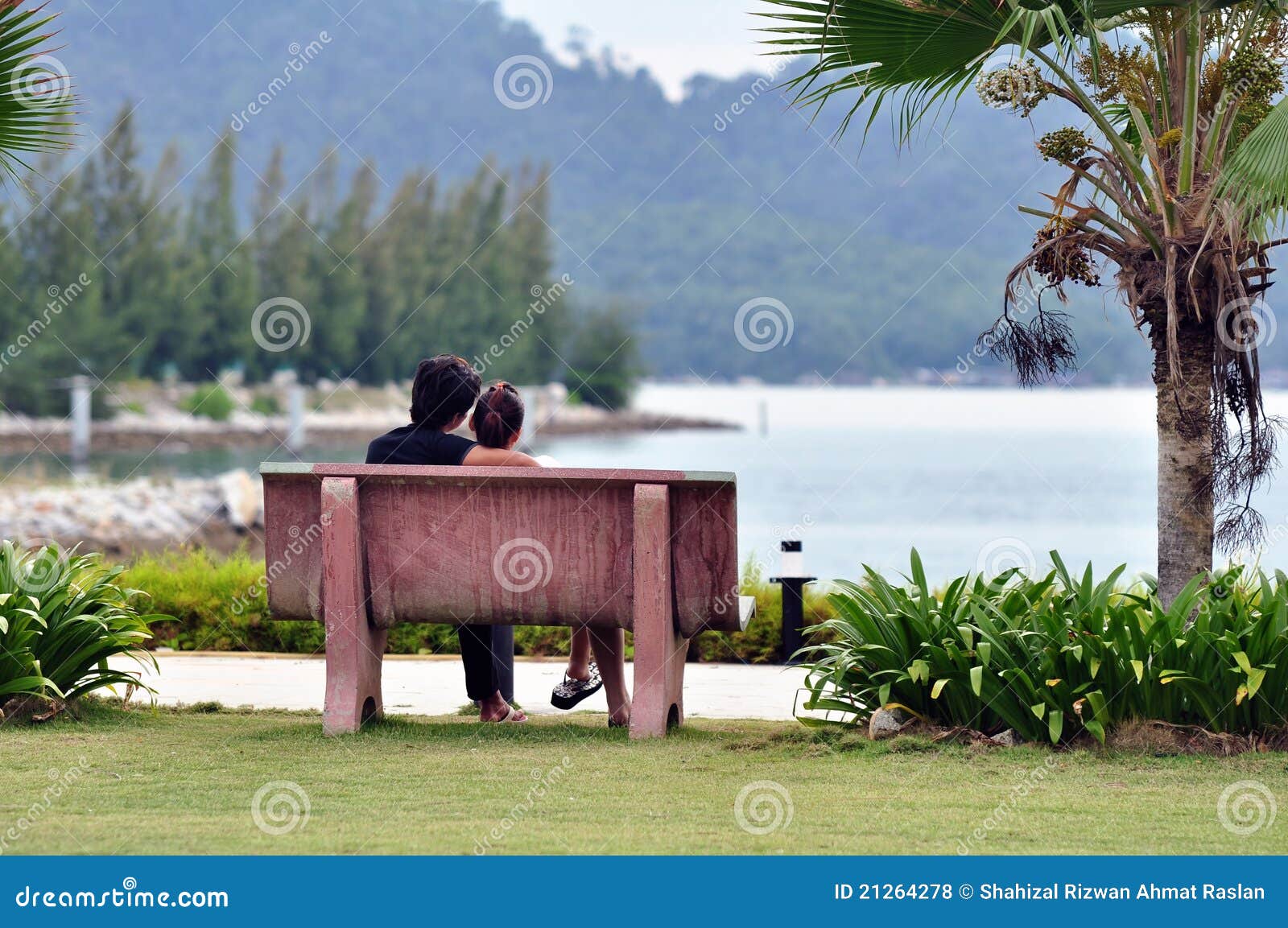 Loving couple on a bench editorial stock photo. Image of cute - 21264278