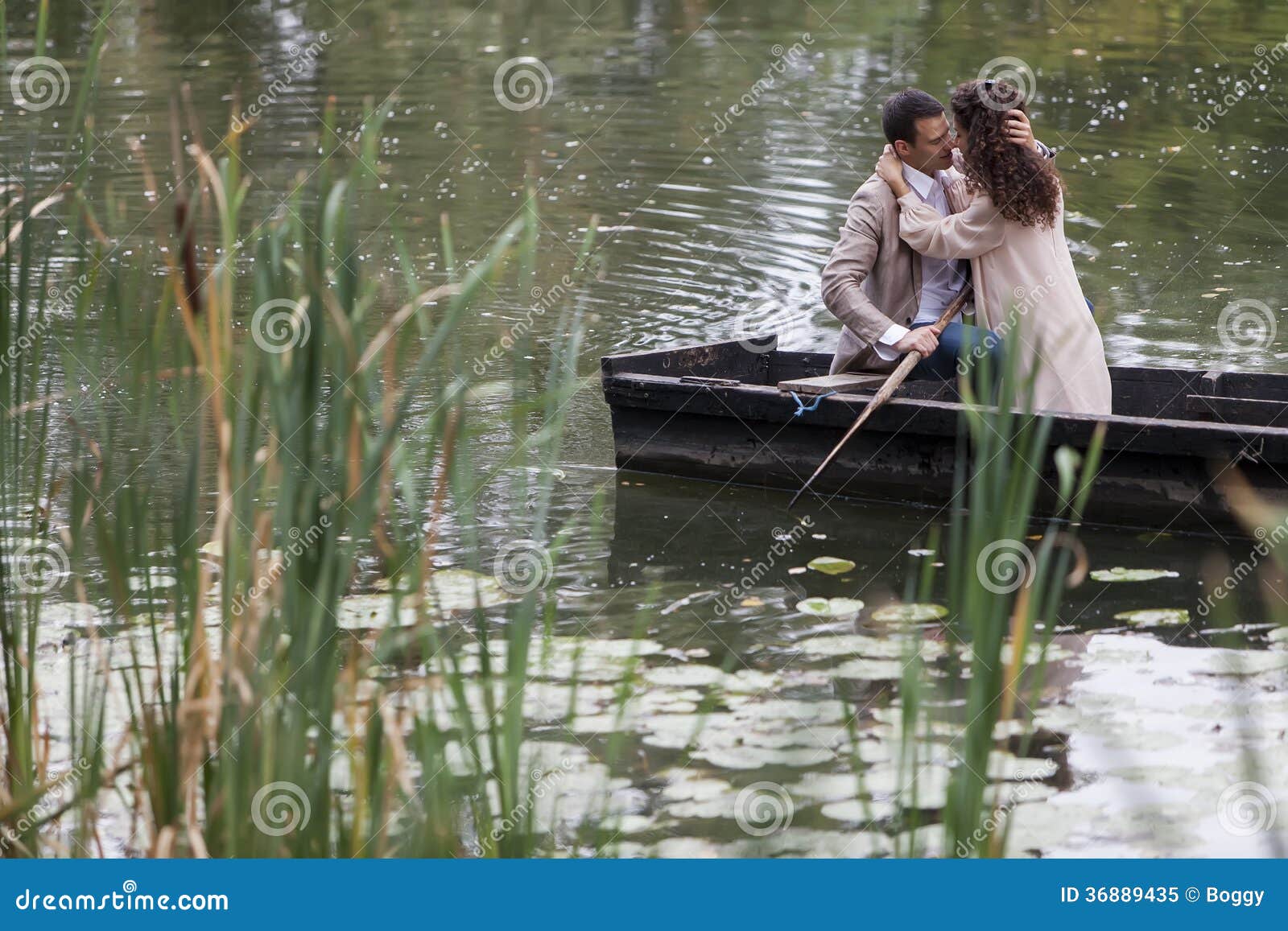 Loving couple in boat stock image. Image of recreation - 36889435