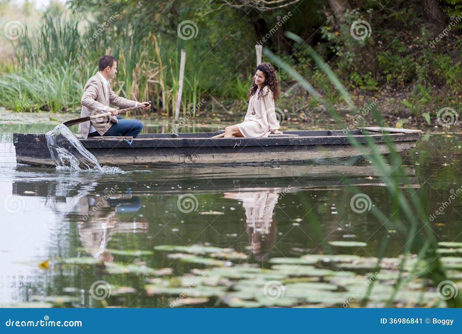 Loving couple in the boat stock image. Image of people - 36986841