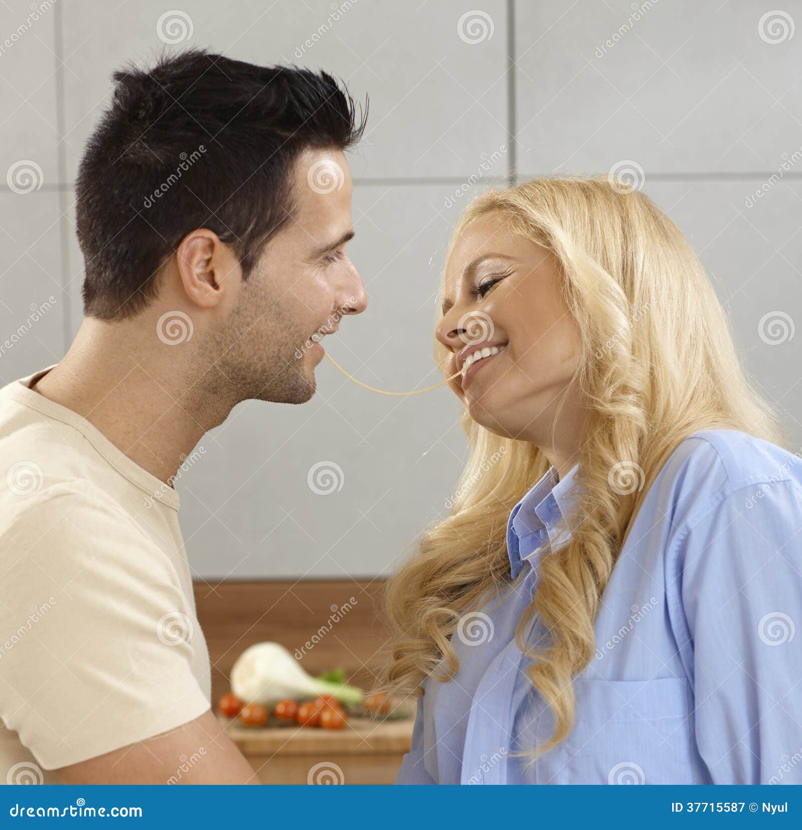 Loving Couple Eating Spaghetti Stock Image - Image of home, color: 37715587