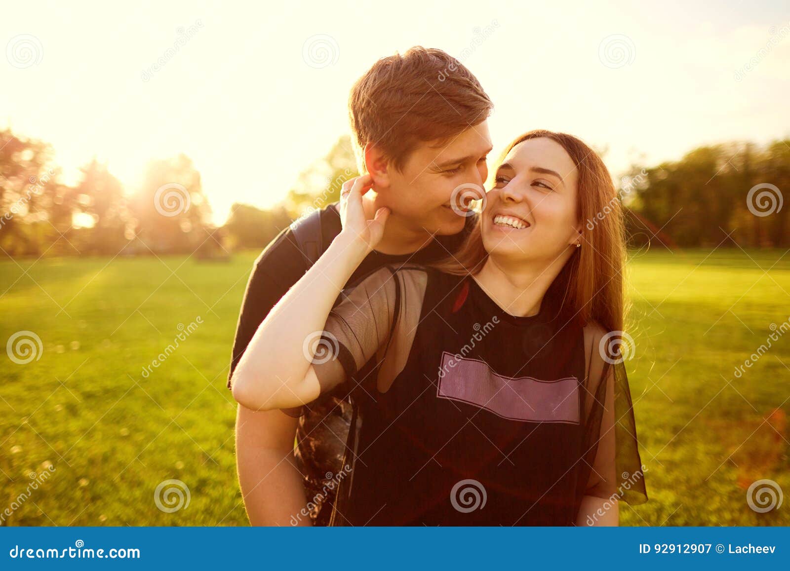 A Loving Couple Hugs in the Park at Sunset Stock Image - Image of ...