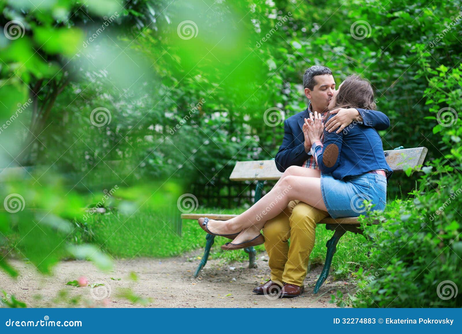 Loving Couple Kissing on a Bench Stock Image - Image of bonding, blue ...