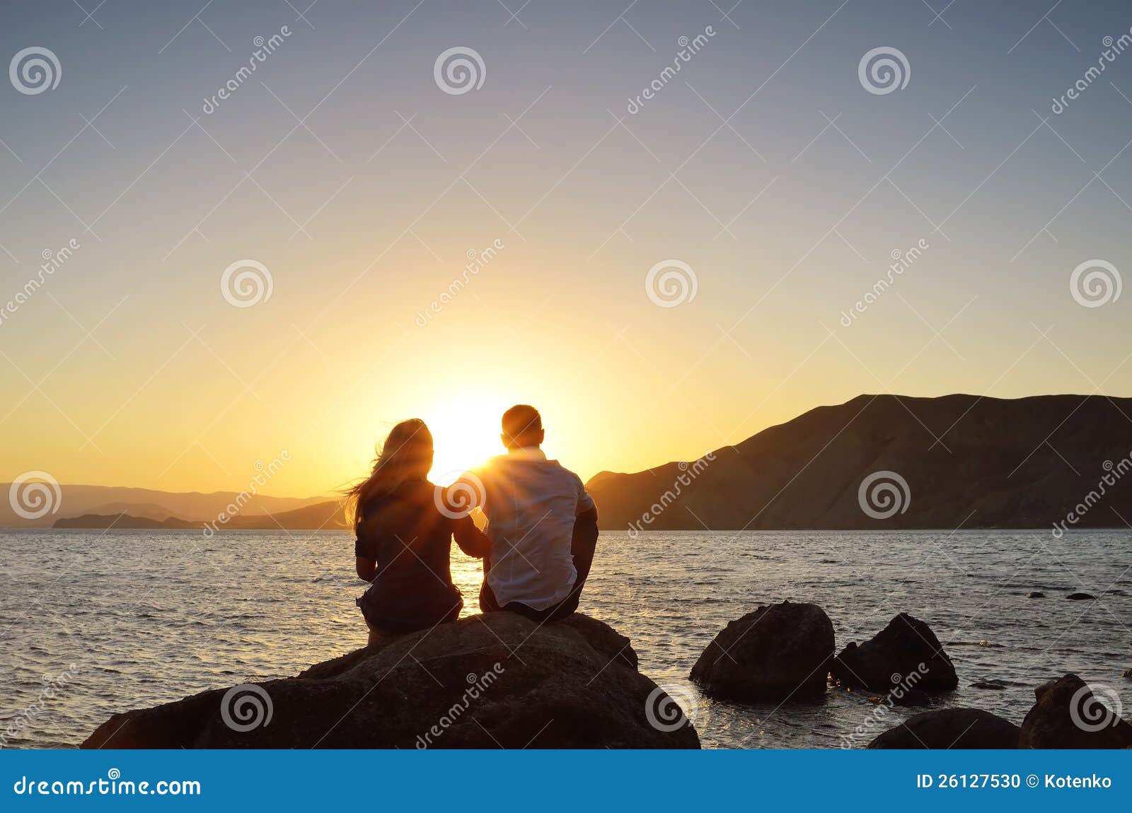 Loving Couple Looking at the Sun Stock Photo - Image of holiday ...