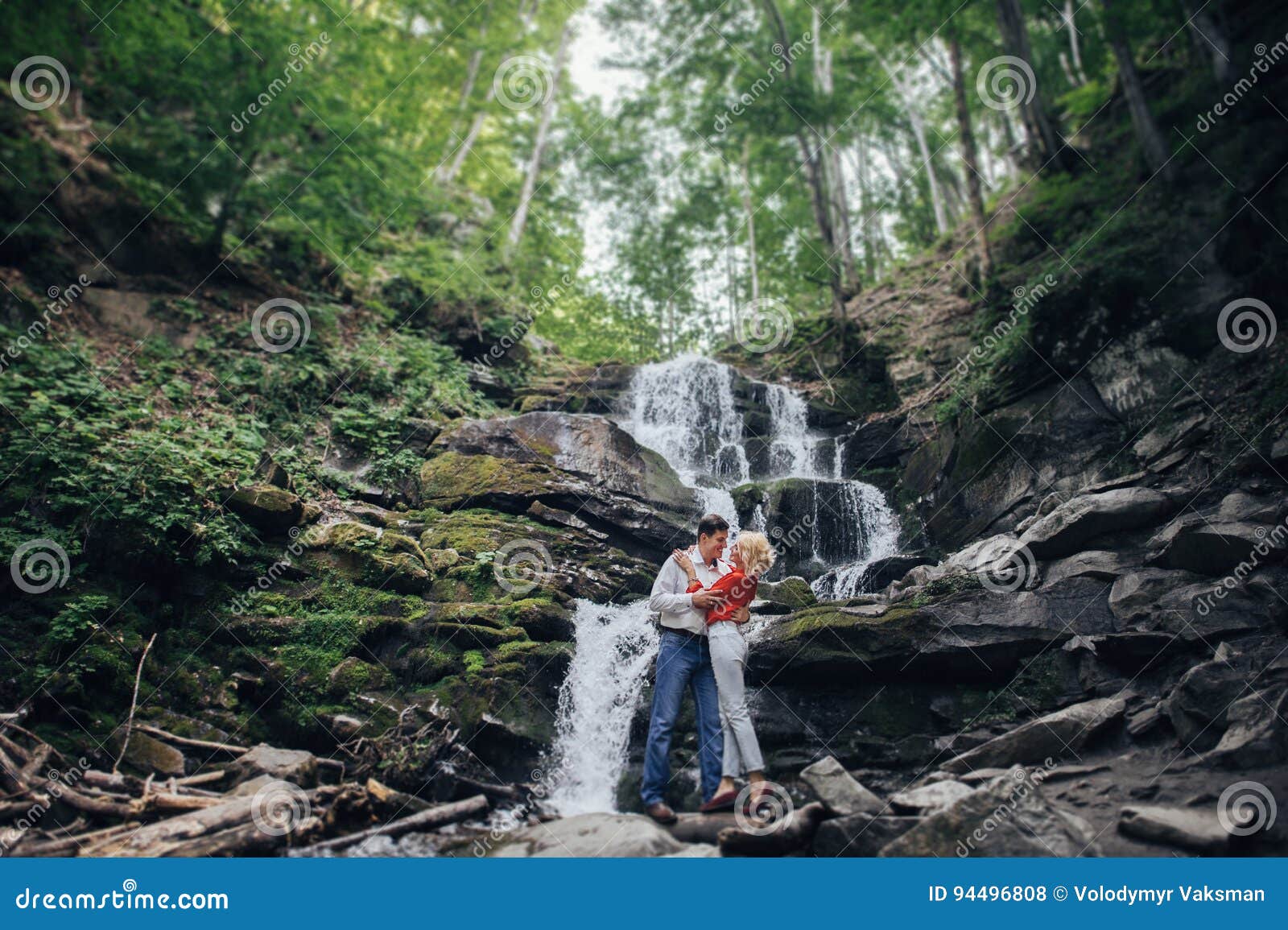 Loving Couple Near a Waterfall in Forest. Stock Photo - Image of ...