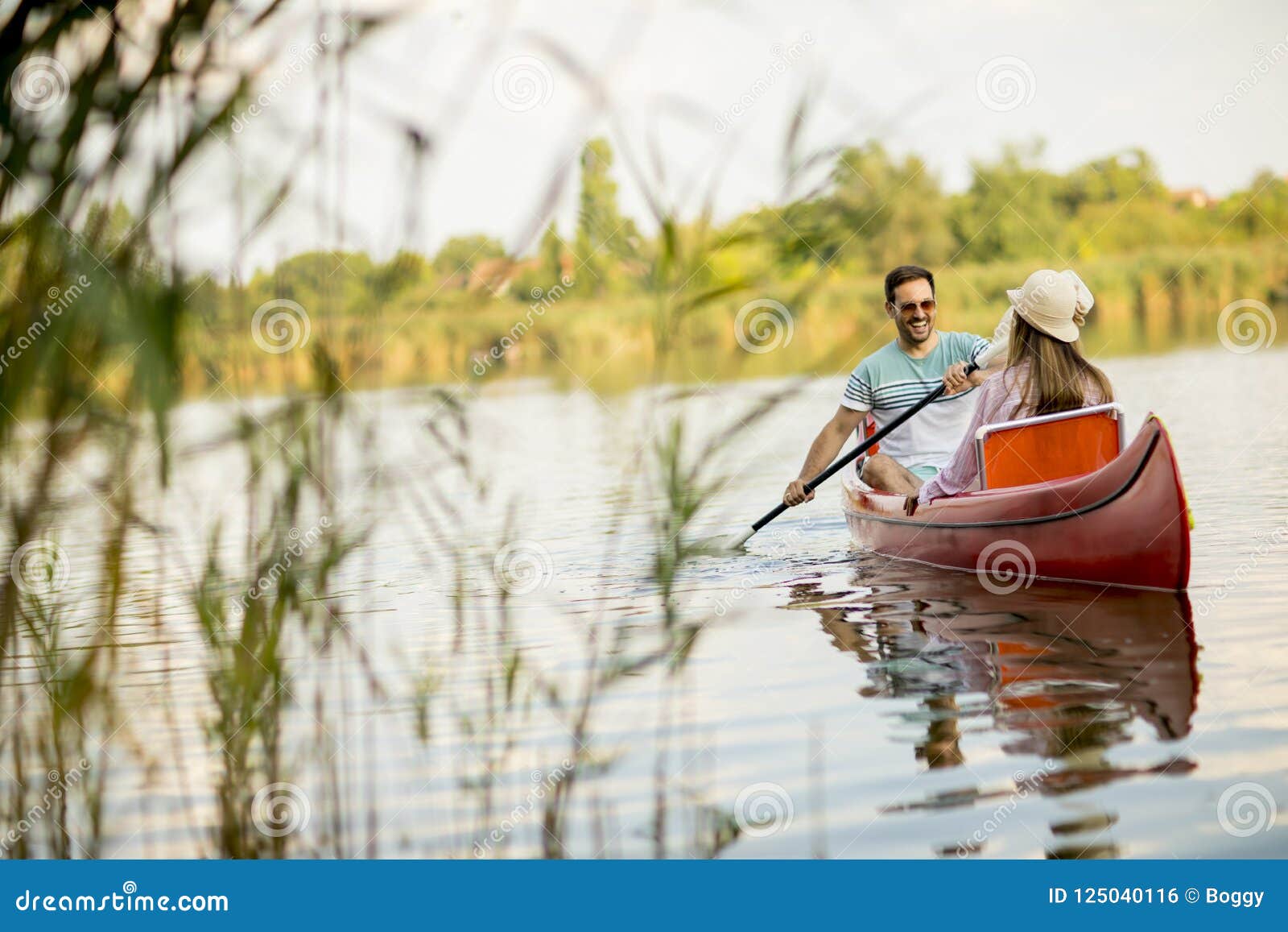 Loving Couple Rowing on the Lake Stock Photo - Image of sport, river ...