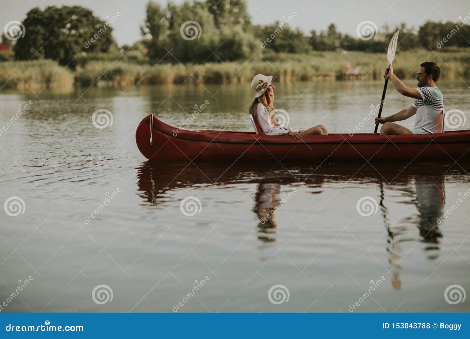 Loving Couple Rowing on the Lake Stock Photo - Image of adventurous ...