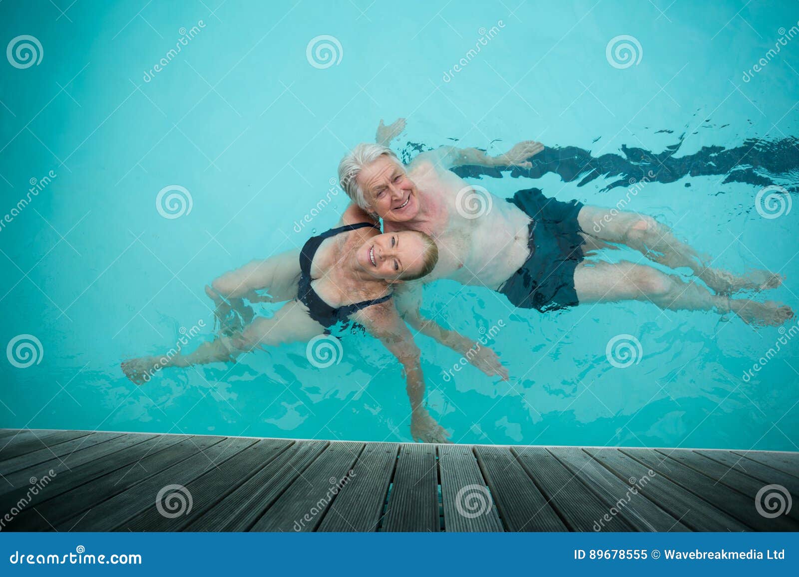 Loving Couple Swimming in Pool Stock Image - Image of pool ...