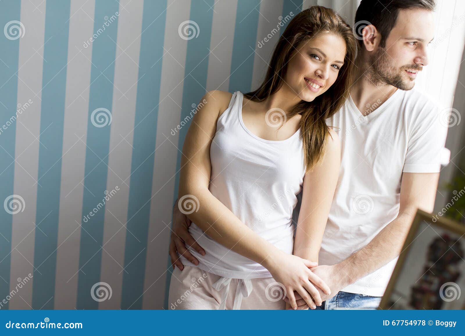 Loving Couple by the Window Stock Photo - Image of romance, together ...