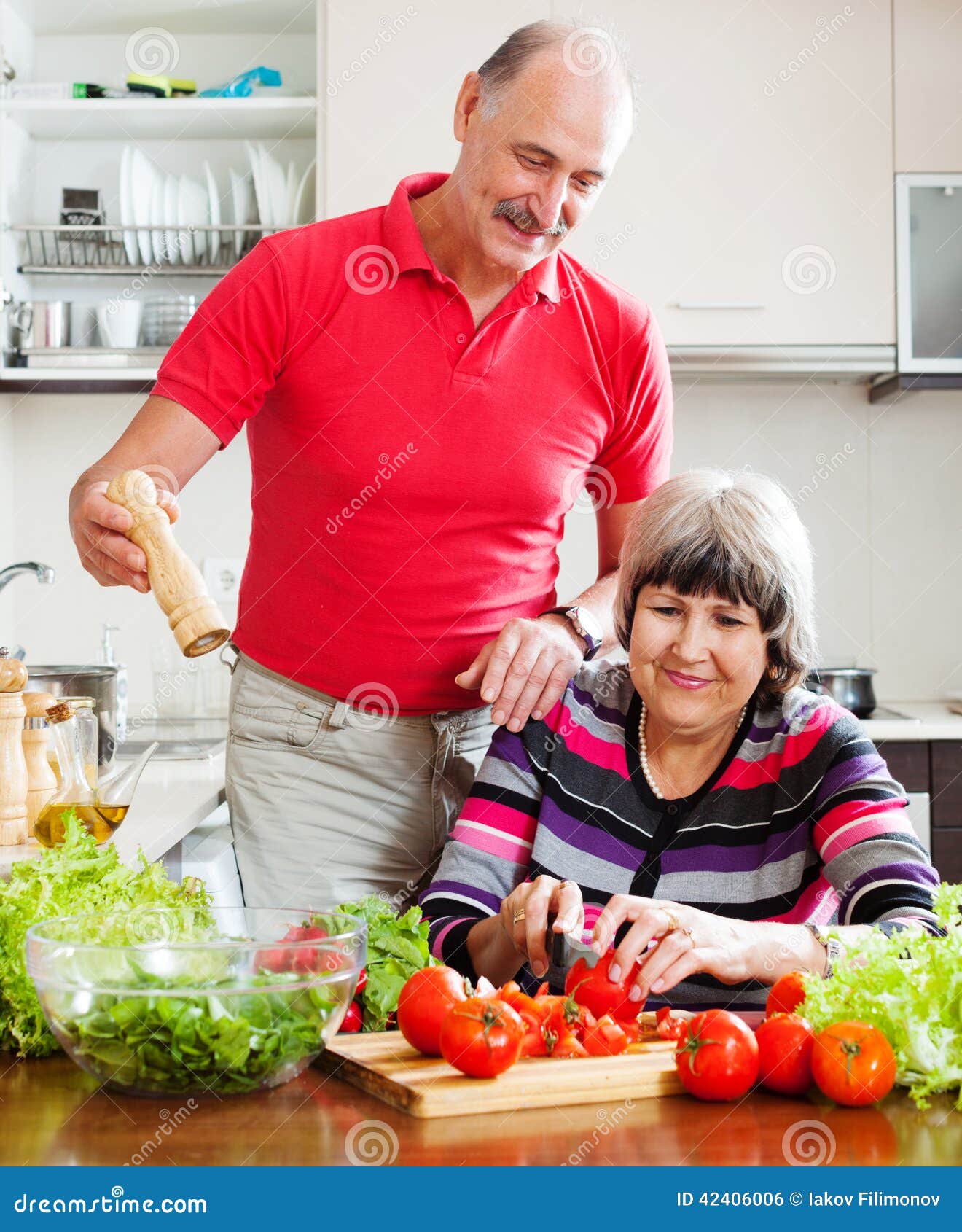 Loving Elderly Couple Cooking with Tomatoes Stock Photo - Image of ...