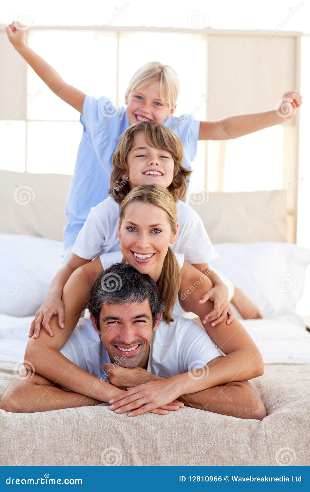 Loving family having fun stock photo. Image of indoor - 12810966