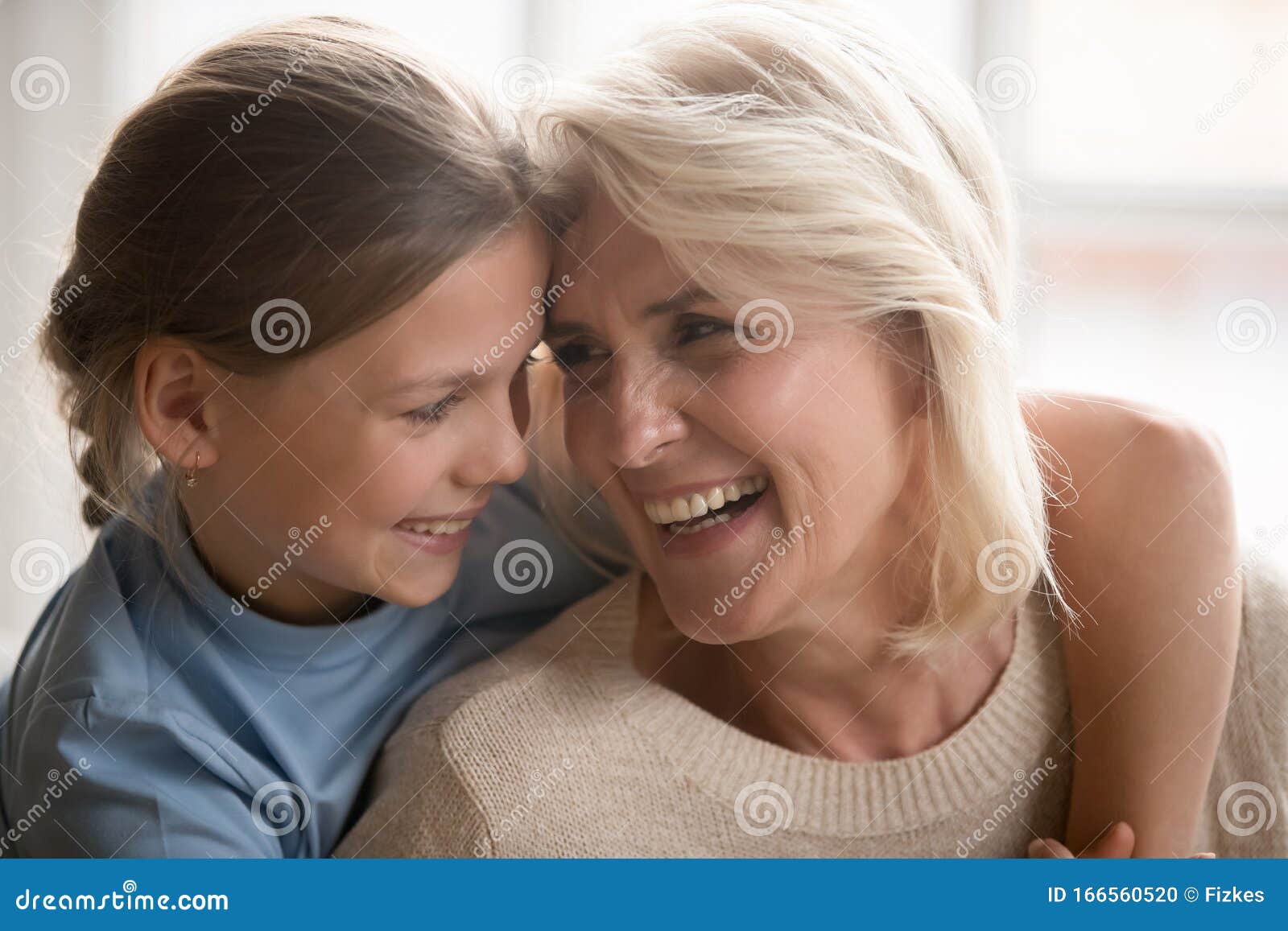 Loving Granddaughter Hug Happy Grandmother Enjoying Time Together Stock