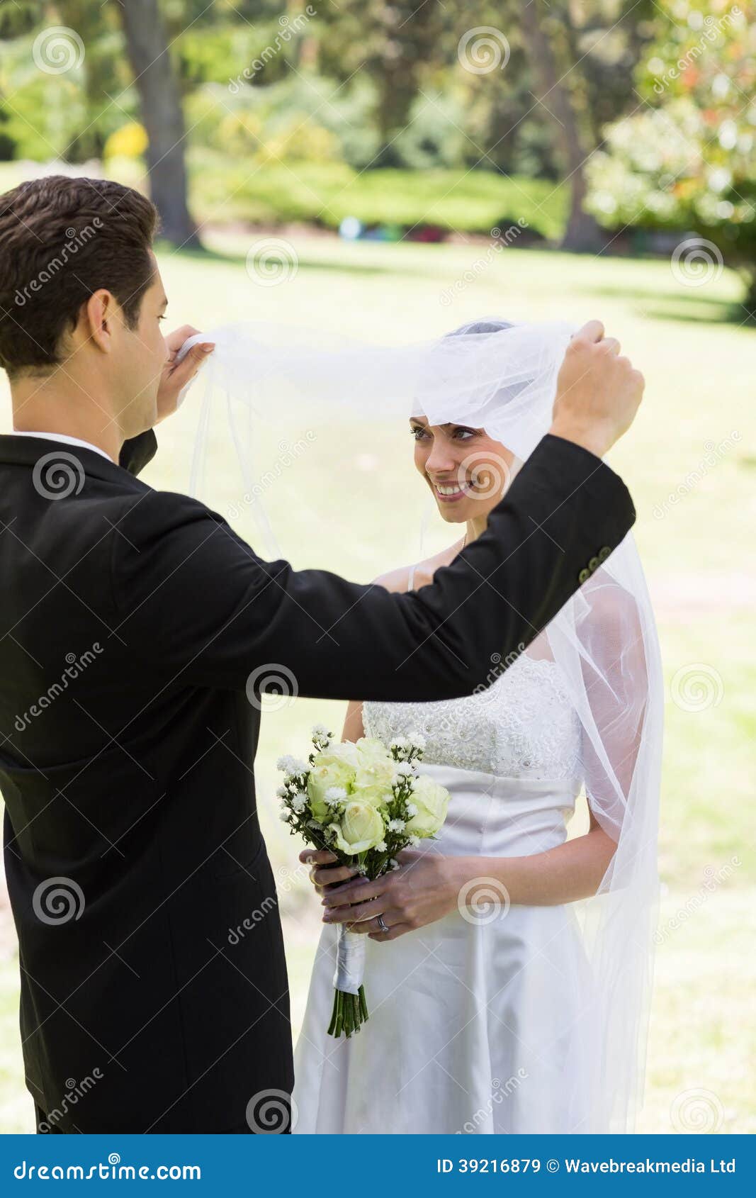 Loving Groom Lifting Veil of Bride Stock Image - Image of quarter ...