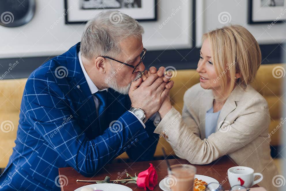 Loving Man Kissing His Woman`s Hands And Showing His Feeling And Love