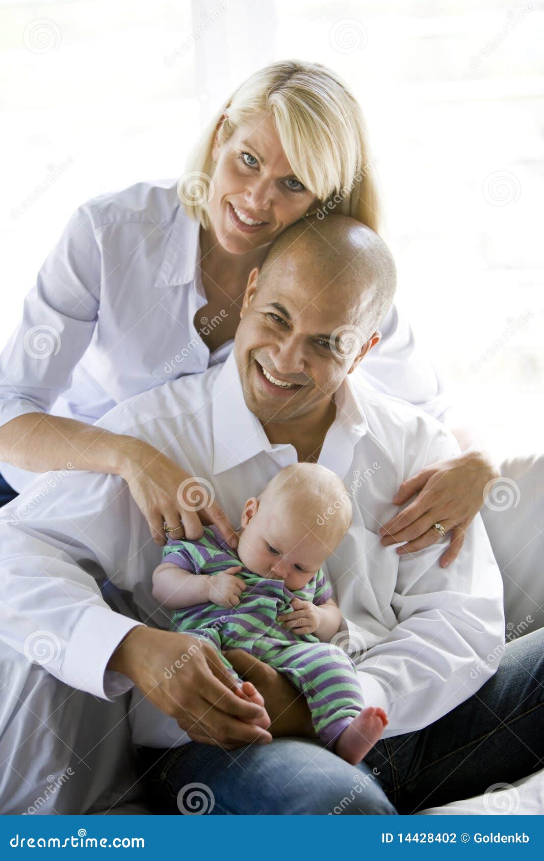 Loving Parents with Sleeping Baby in Dad S Lap Stock Photo - Image of ...