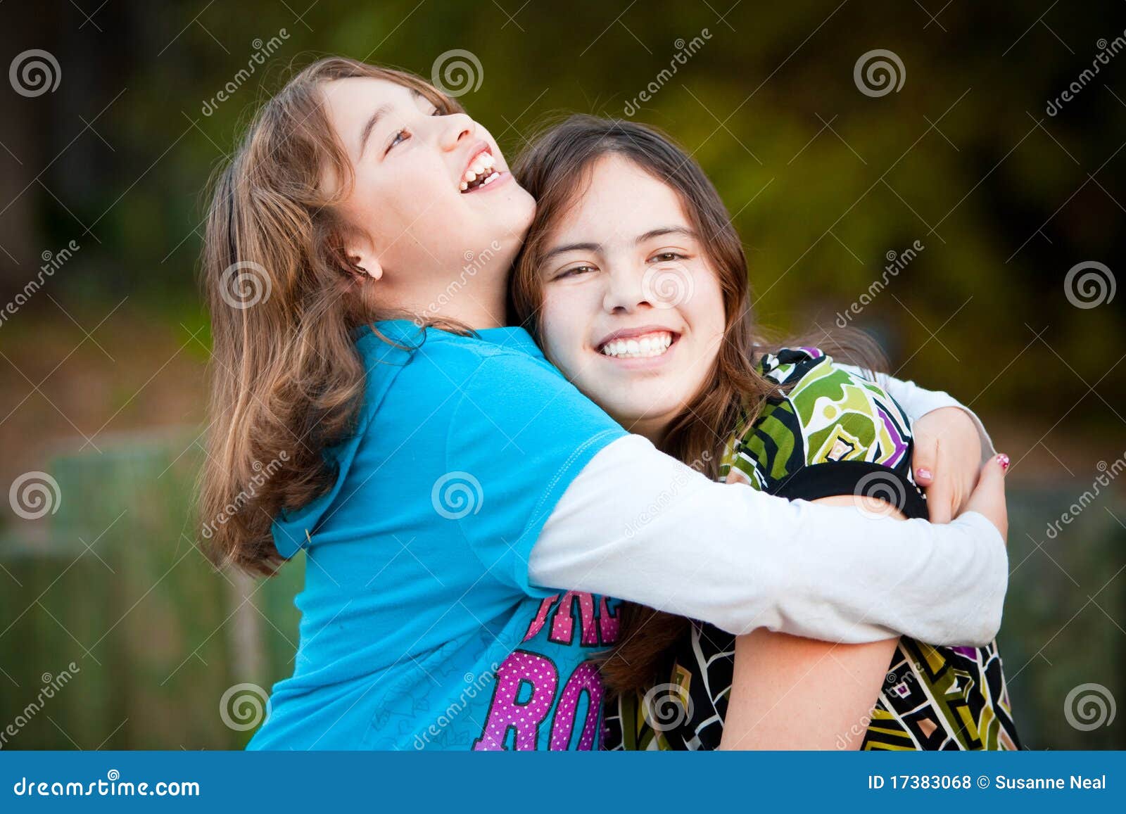 Loving Sisters Hugging and Smiling Stock Photo - Image of smiles ...
