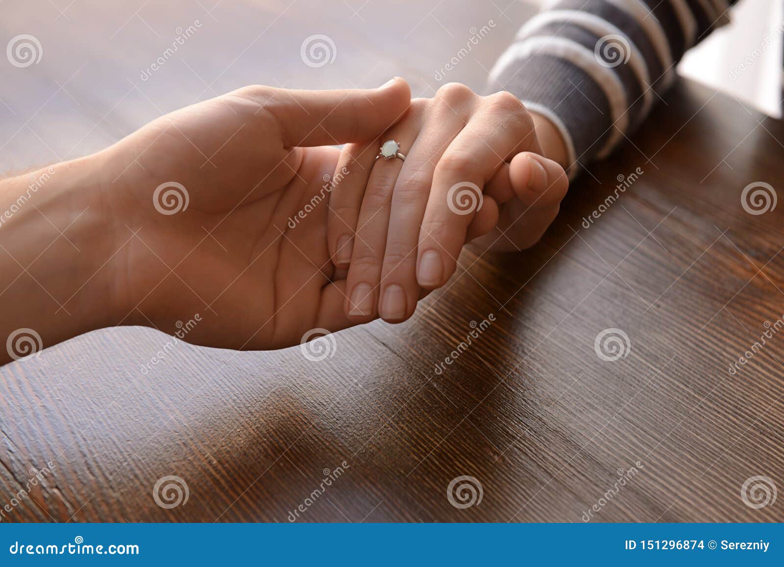 Loving Young Couple Holding Hands at Table, Closeup Stock Photo - Image ...