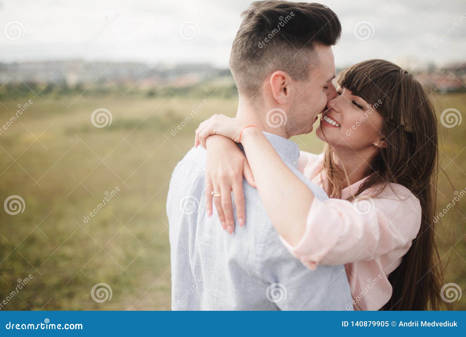 Loving Young Couple Kissing And Hugging In Outdoors Love And