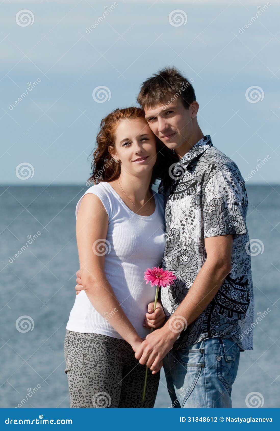 Loving young couple at sea stock photo. Image of beautiful - 31848612