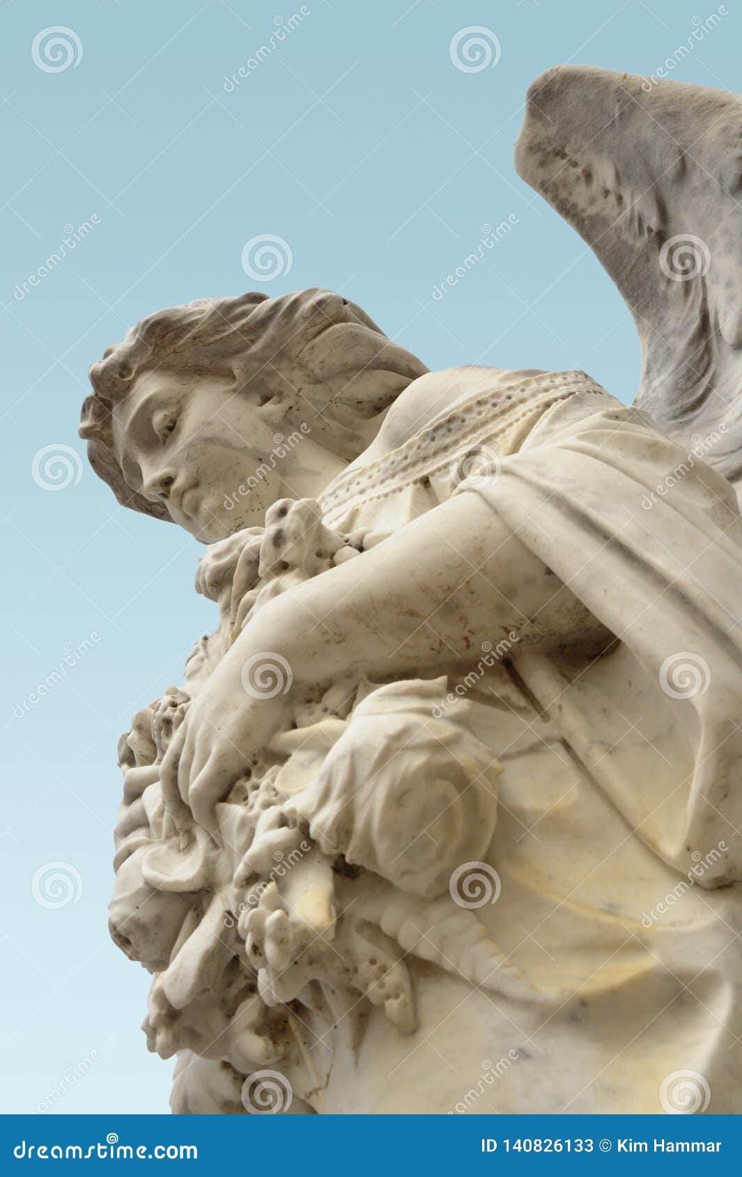 A Low Angel View of an Angel Statue Lookng Down Protectively Stock ...