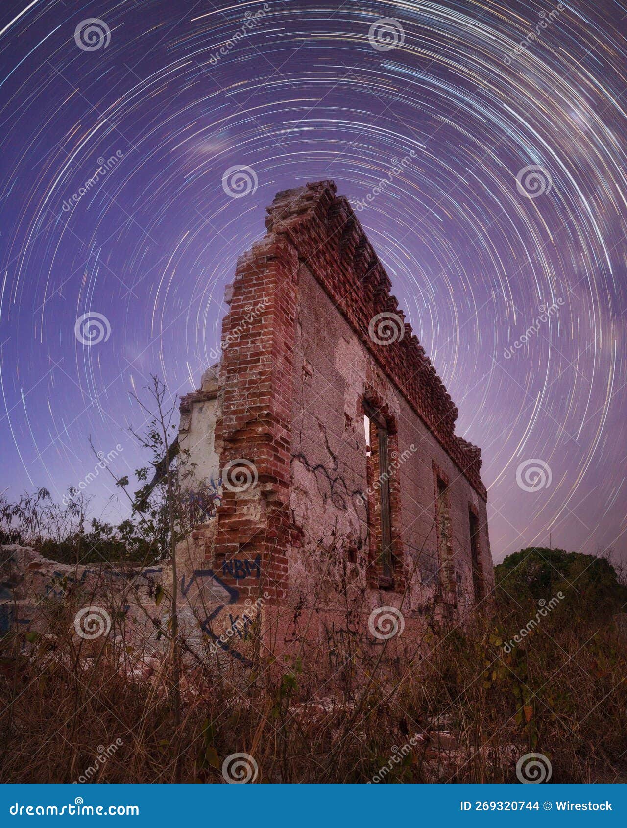 Low-angle of an Abandoned Building Ruins with Night Star Trails in the ...
