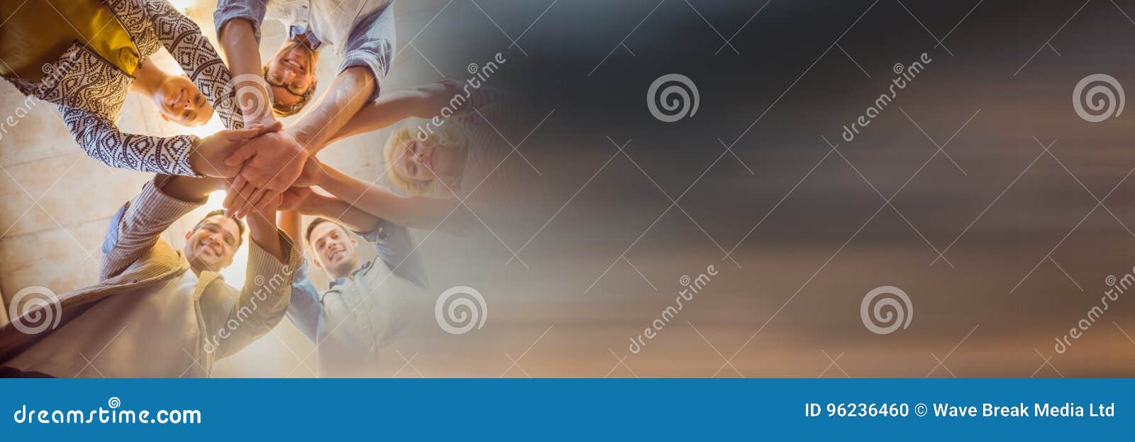 Low Angle of Creative Team Putting Hands Together and Blurry Sunset ...