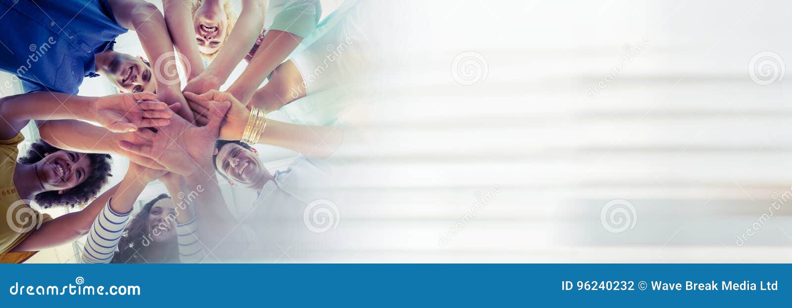 Low Angle of Creative Team and Putting Hands Together and Blurry White ...