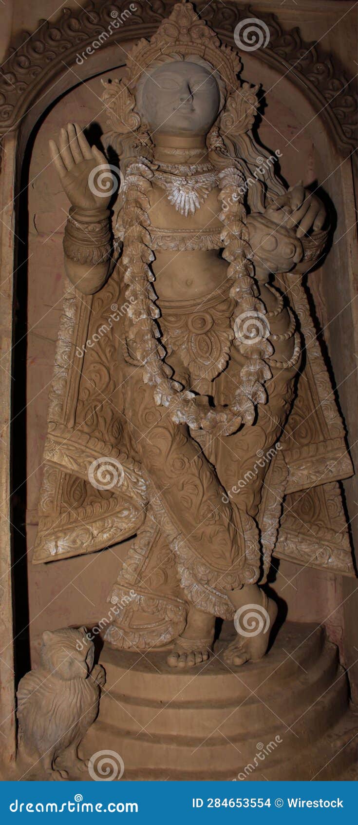 Low Angle of a Deity Sculpture in a Shrine with a Dim Lighting Stock ...