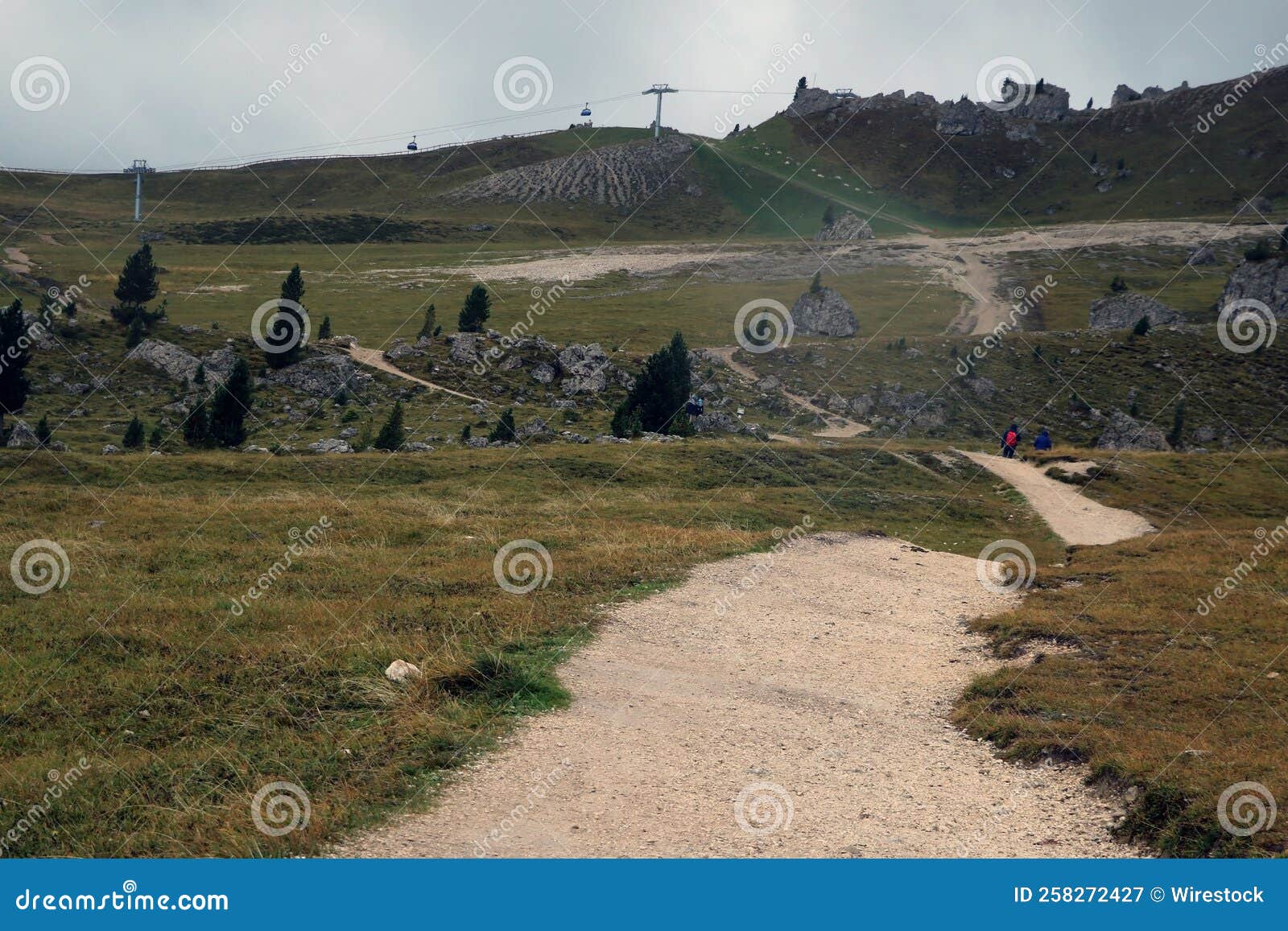 Low-angle of a Dusty Path Leading To the Mountains with Gloomy Sky ...