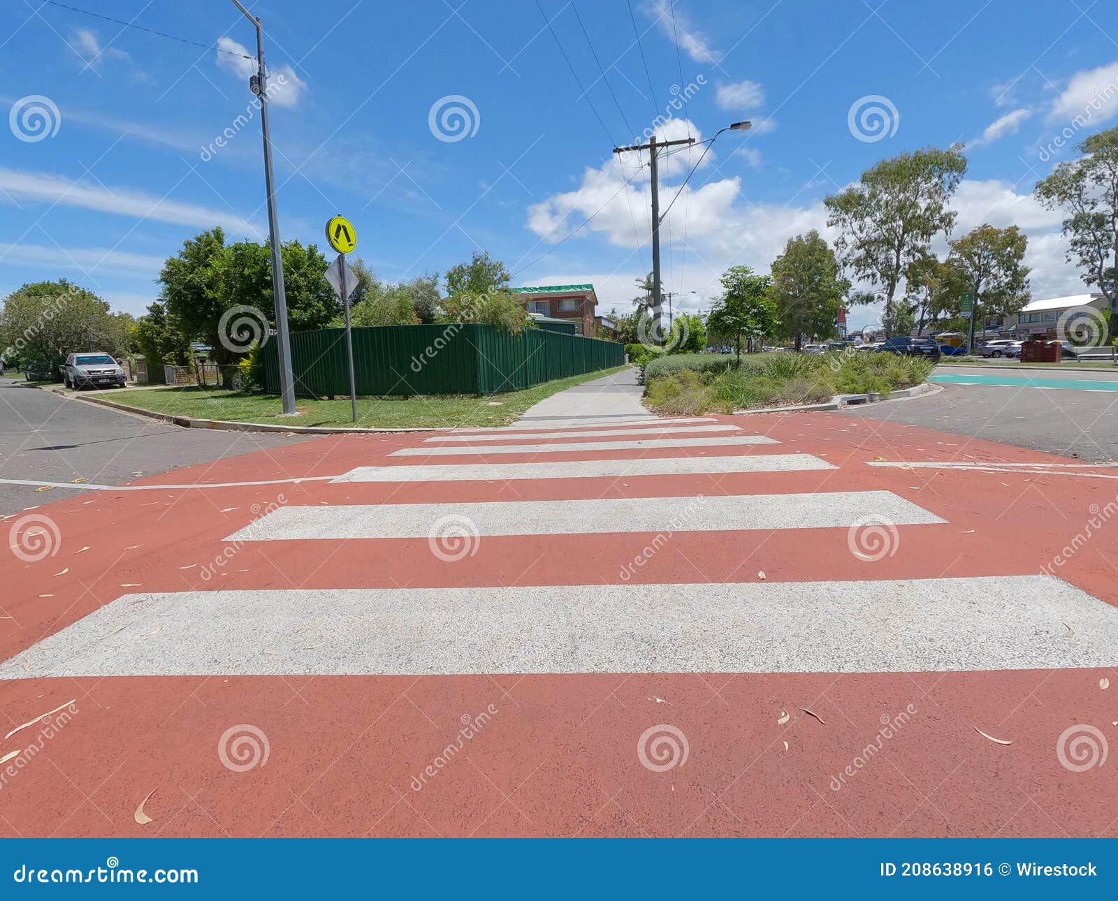 Low Angle Frontal View of Red and White Crosswalk during Sunny Day ...