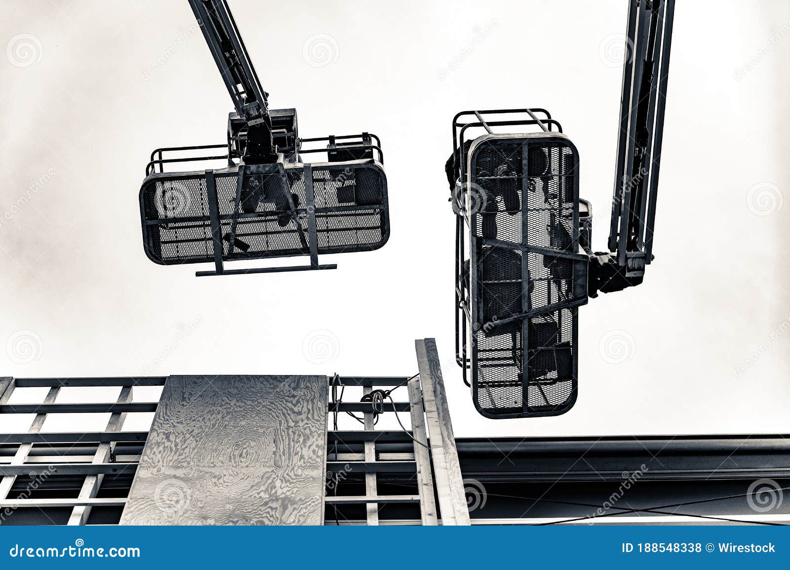 Low Angle Grey Scale Shot of Mobile Moving Cranes Stock Photo - Image ...