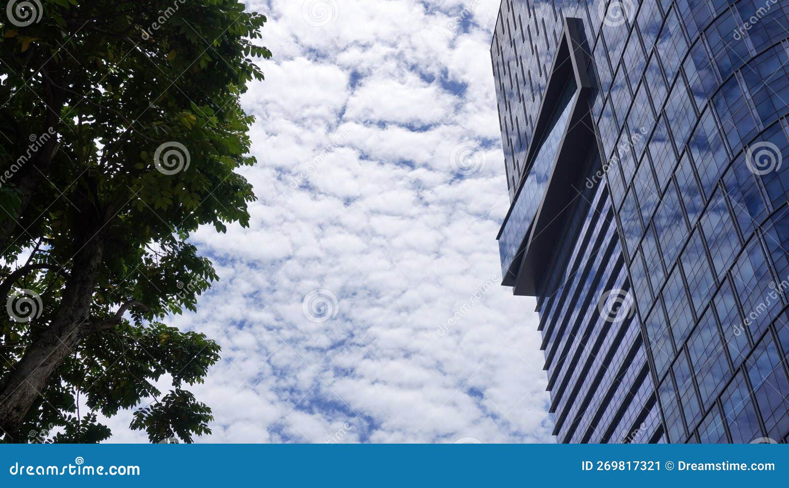 Low Angle High Tower Building with Beautiful Cloud Sky Background Stock ...