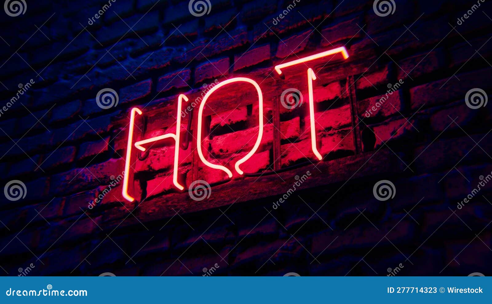Low Angle of an Illuminated Red Neon Sign "Hot" Attached To a Brick ...