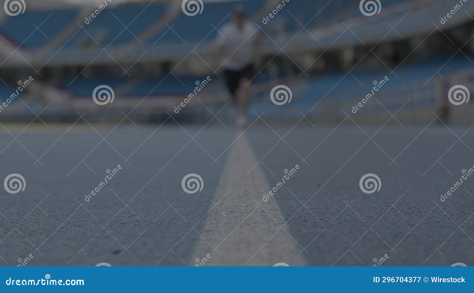 Low Angle of a Man Running on the White Line in the Track Stock Video ...