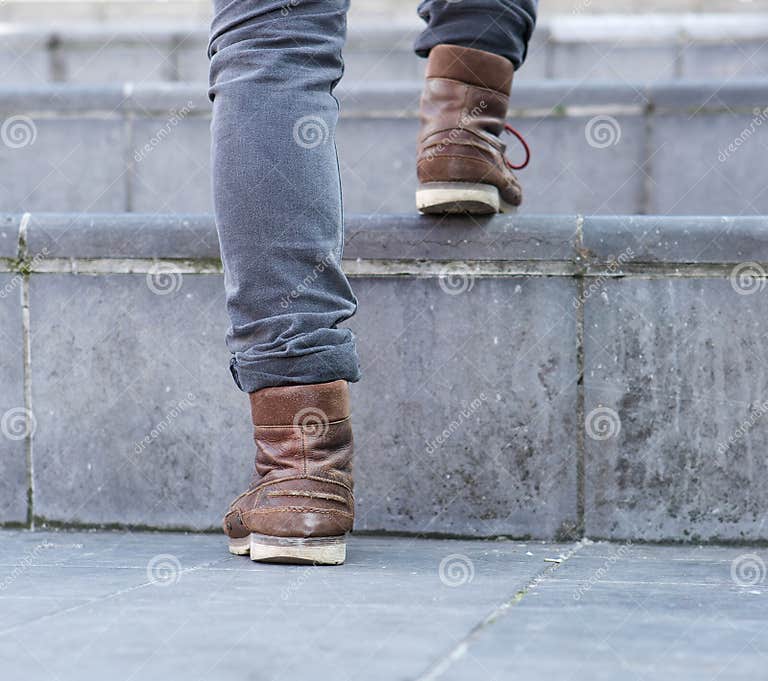 Low Angle Man Walking Up Steps Stock Image - Image of boots, people ...