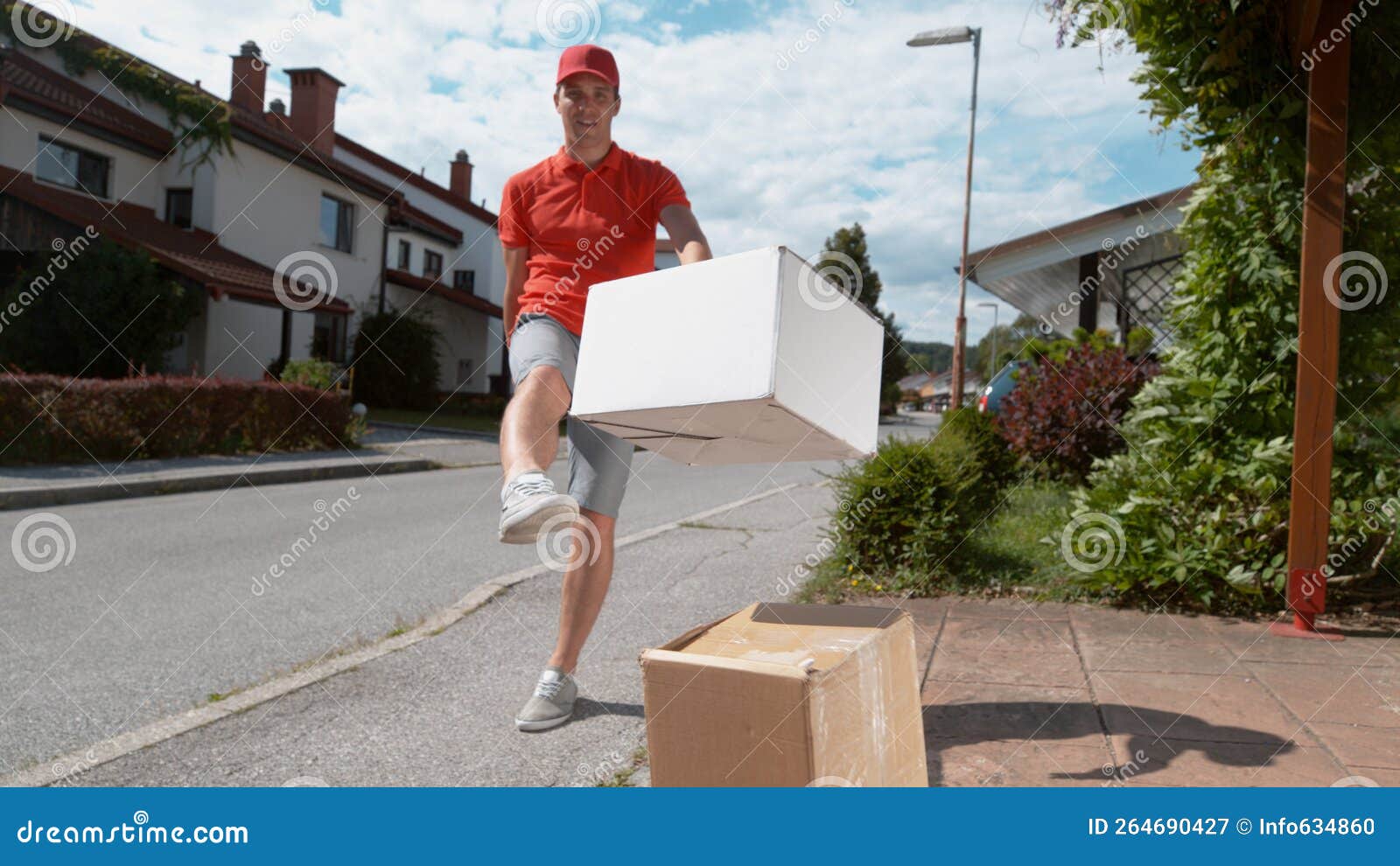LOW ANGLE: Parcel Delivery Guy Drop Kicks a Package into Someone S ...