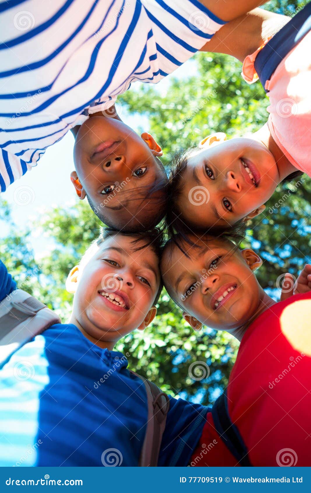 Low Angle Portrait of Happy Children Forming Huddle Stock Image - Image ...