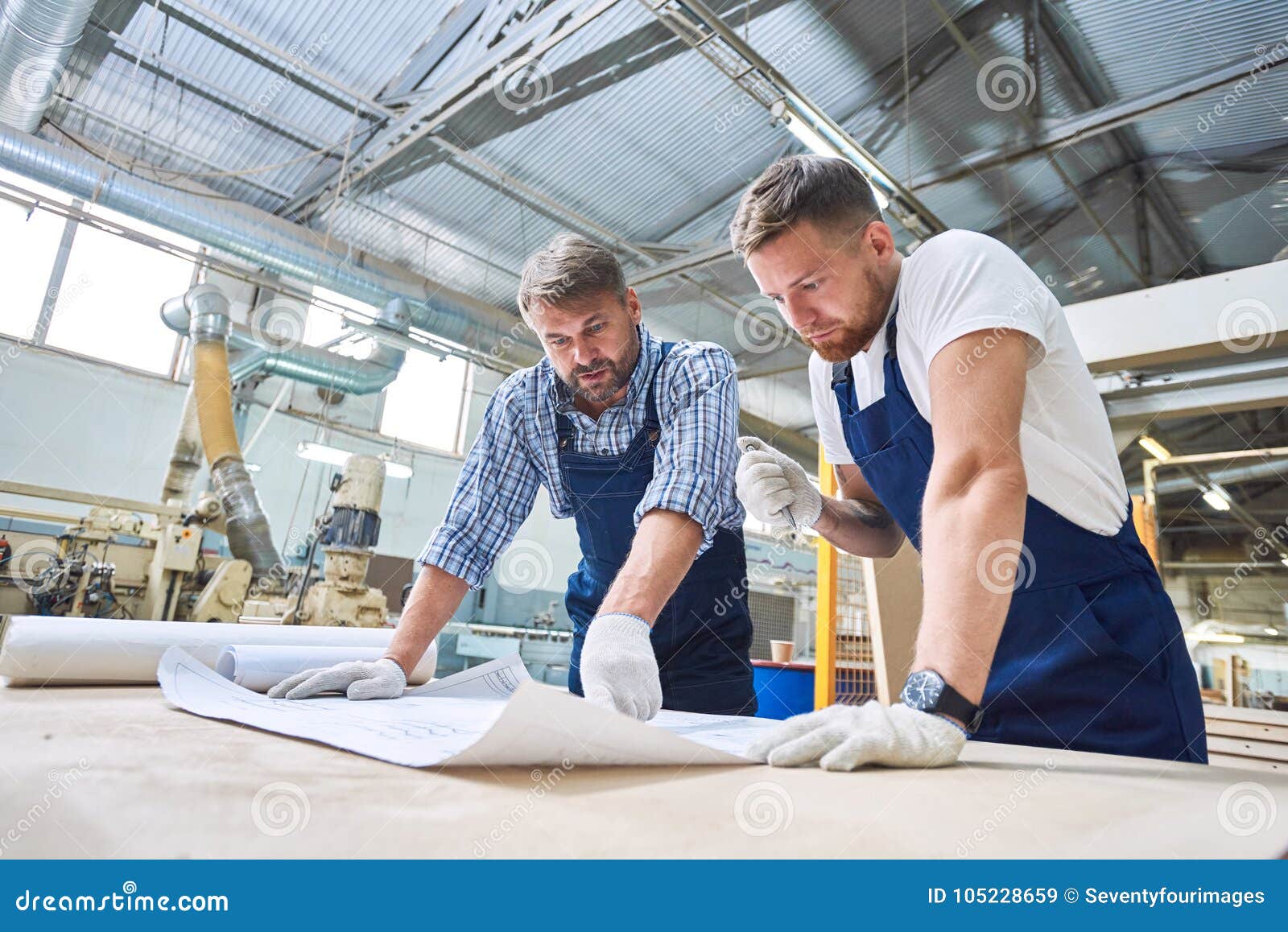 Construction Workers Looking at Plans Stock Image - Image of industrial ...