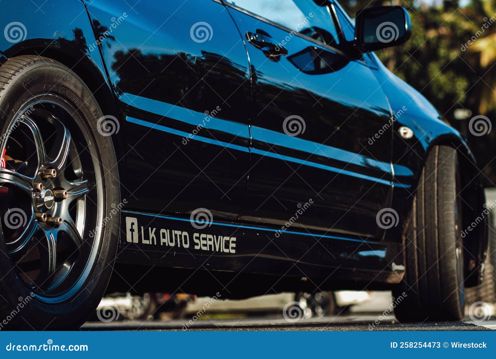 Low-angle Profile View of a Dark Blue Mitsubishi Evo 7 Car Editorial ...